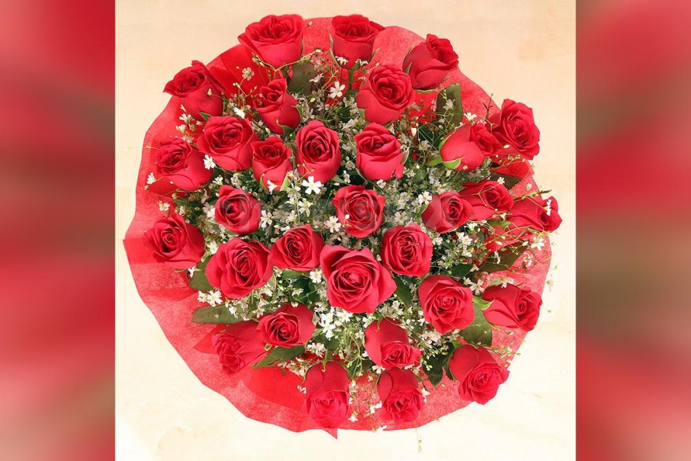 Send a simple 30 Red Roses in red color paper Bouquet to surprise them ...