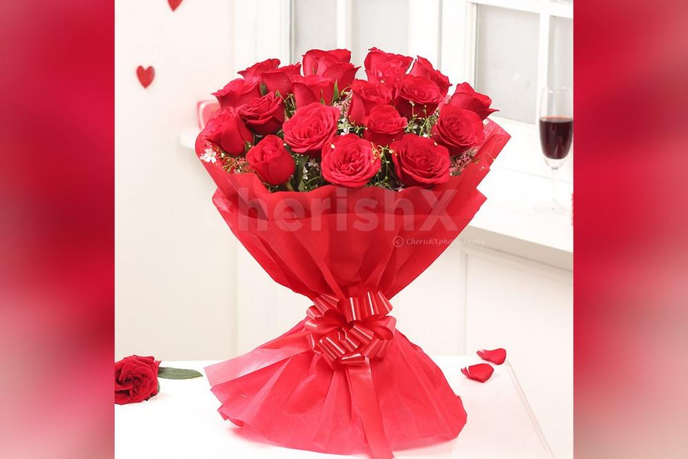 Send a simple 20 Red Rose in red paper package with 16 Ferrero Rocher ...