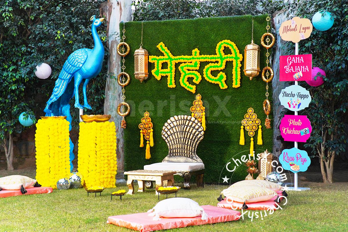 A peacock themed decoration for a mehndi ceremony is a great way to ...