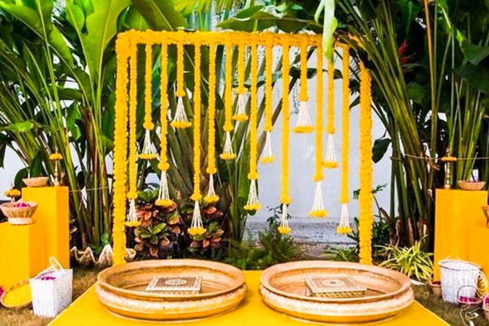 Enjoy a thrilling Haldi with stunning marigold decor that spread ...