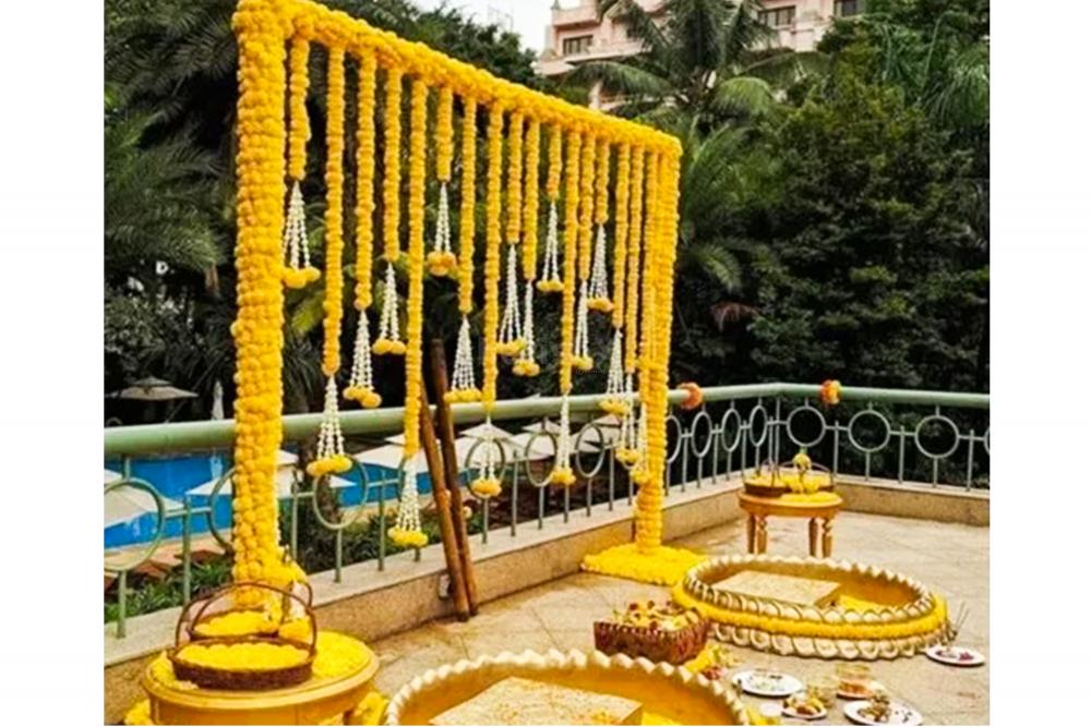 Enjoy a thrilling Haldi with stunning marigold decor that spread ...