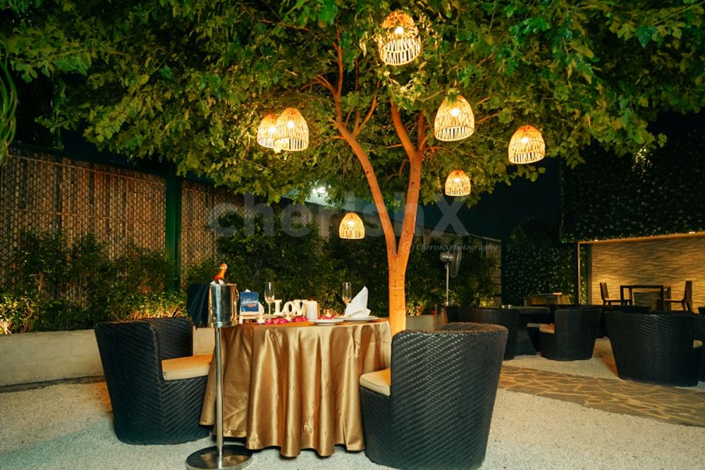 Revel in Romance with a Candlelit Dinner Under the Tree at Radisson ...